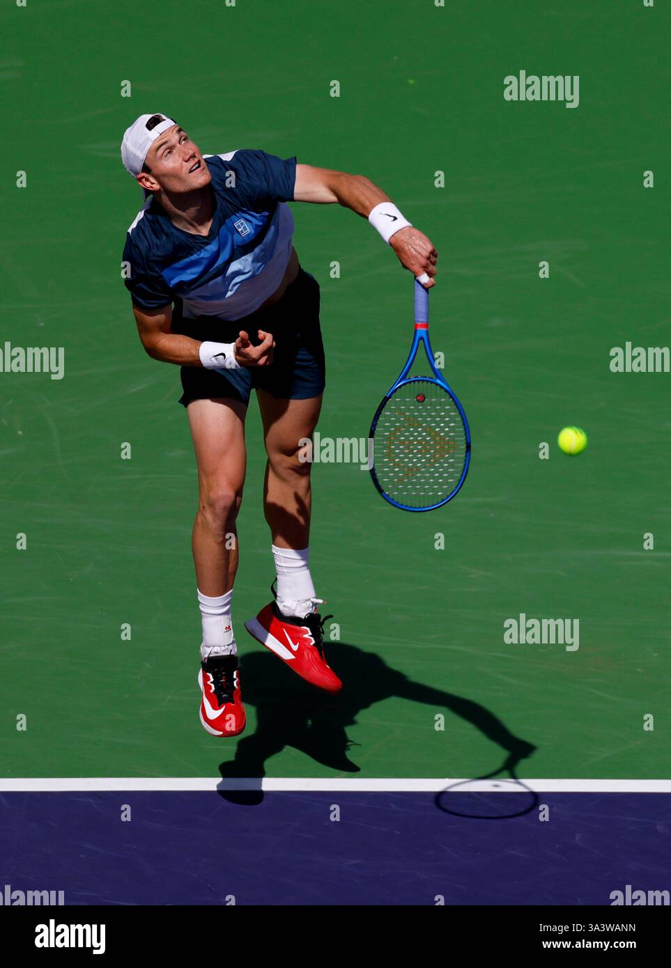 March 16, 2025 Jack Draper of Great Britain serves to Holger Rune of ...