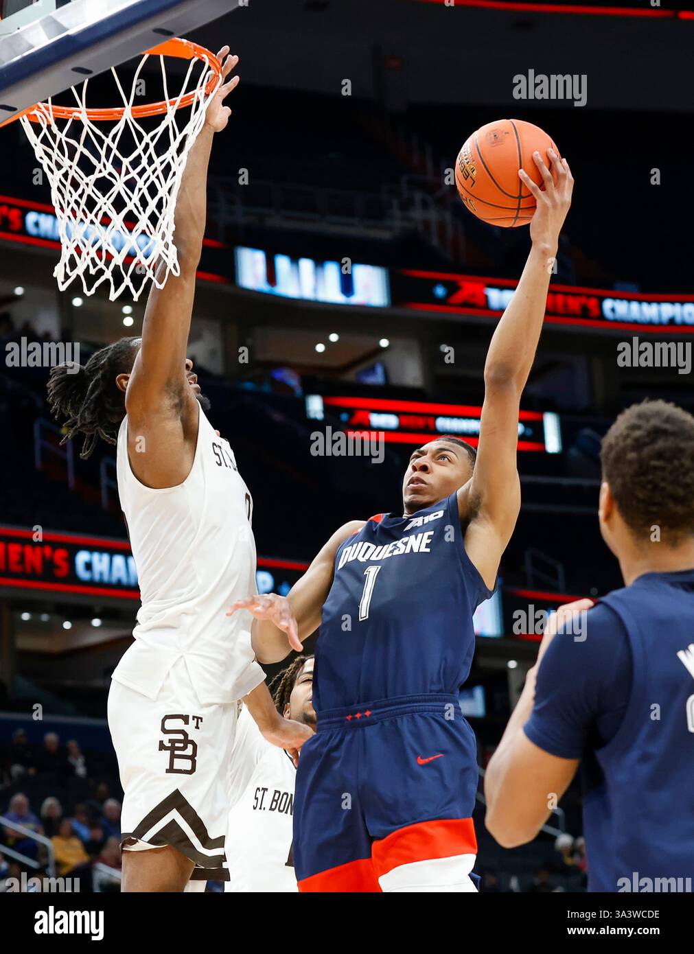 March 13, 2025: Duquesne Dukes Guard (1) Cam Crawford goes to the hoop ...