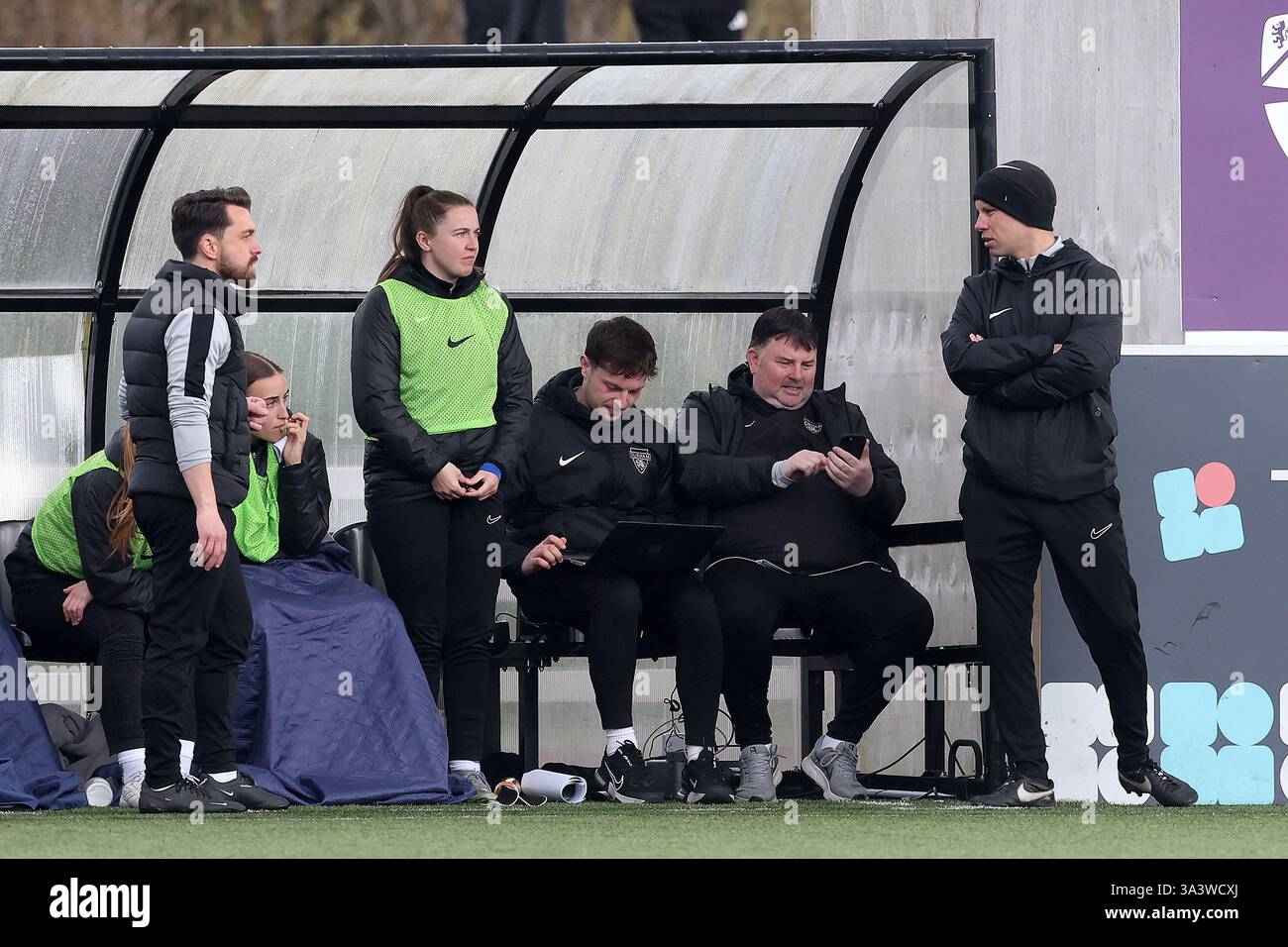 Durham Womens' Director of Football Lee Sanders is seen on his phone ...