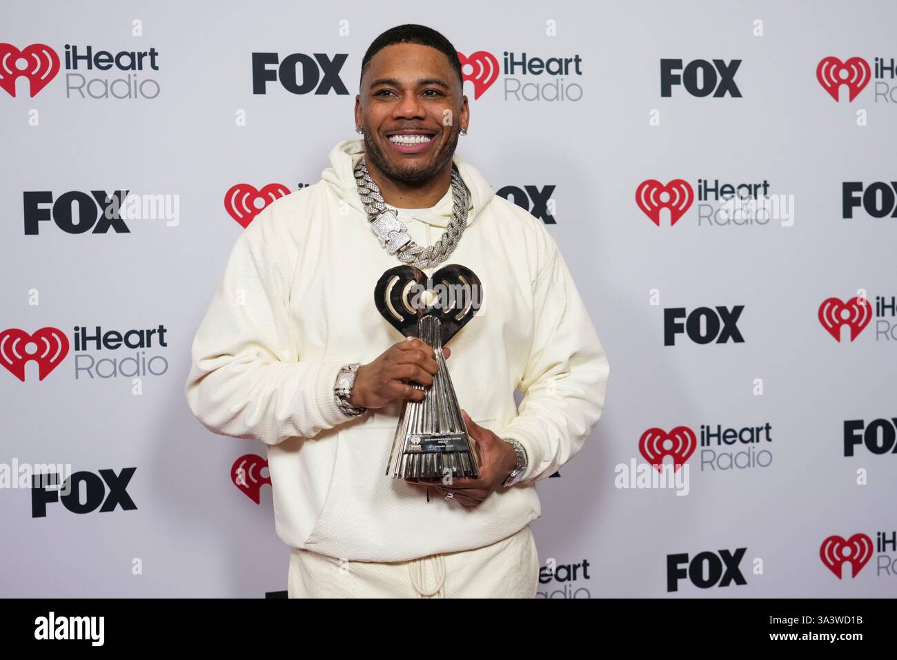 Nelly, winner of the landmark award, poses in the press room during the ...