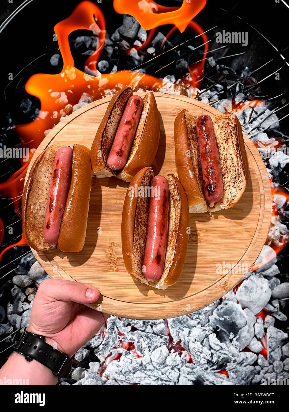 Traditional hot dog with sausage grilled on the barbecue Stock Photo ...