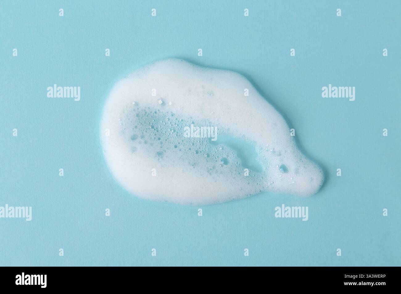 Sample of fluffy foam on light blue background, top view Stock Photo ...