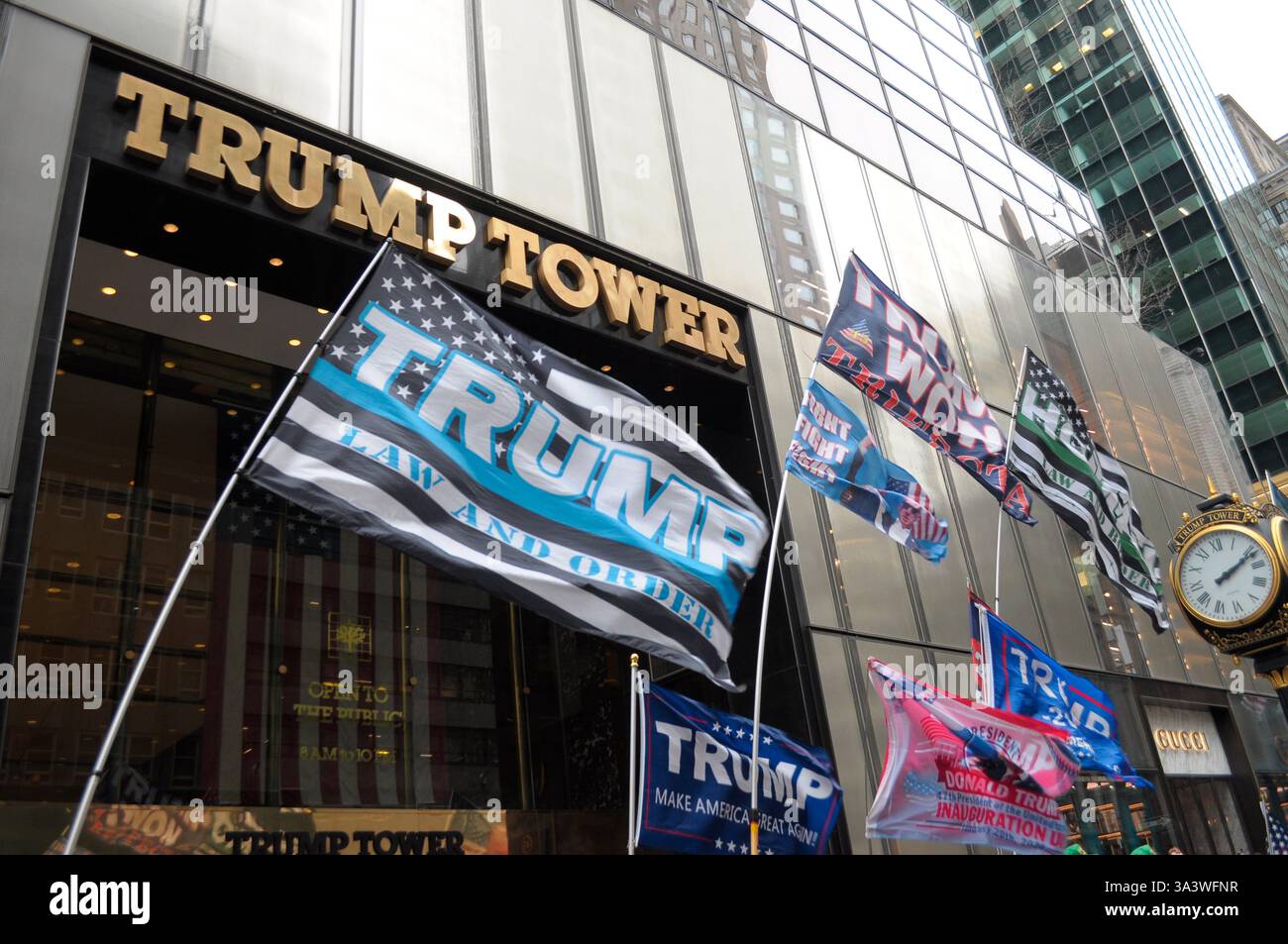 New York, United States. 17th Mar, 2025. Trump supporters wave Trump ...