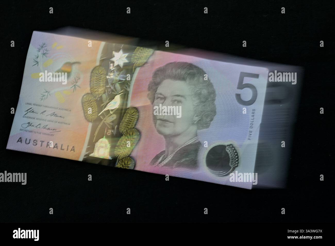 Canberra, Australia. 18th Mar, 2025. An Australian five dollar bank note is pictured in Canberra ...