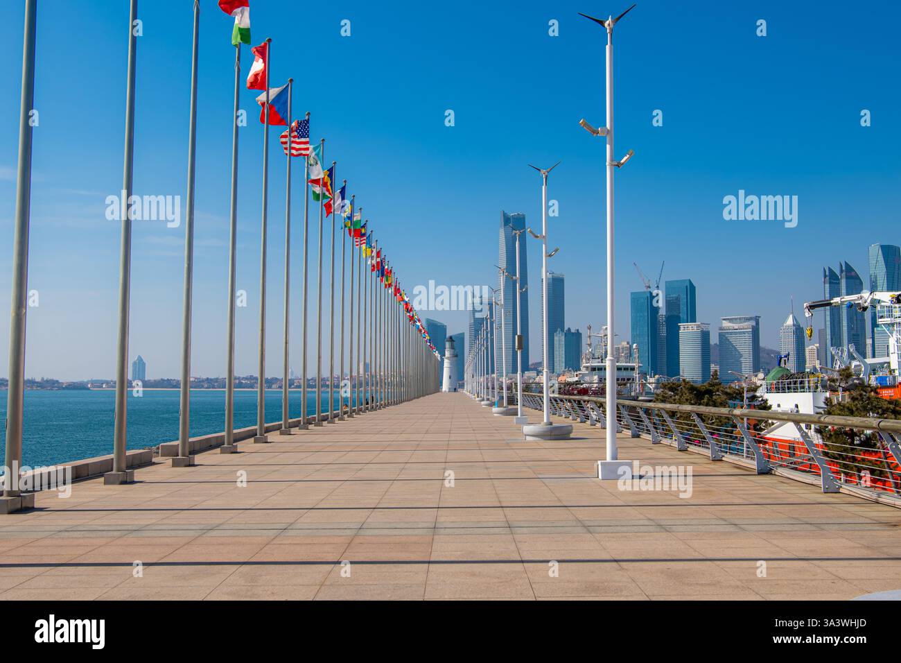FEBRUARY 8, 2022, QINGDAO, CHINA: Alley with the flags and the ...