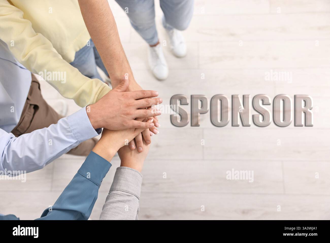 Sponsor. People holding hands together indoors, top view Stock Photo ...