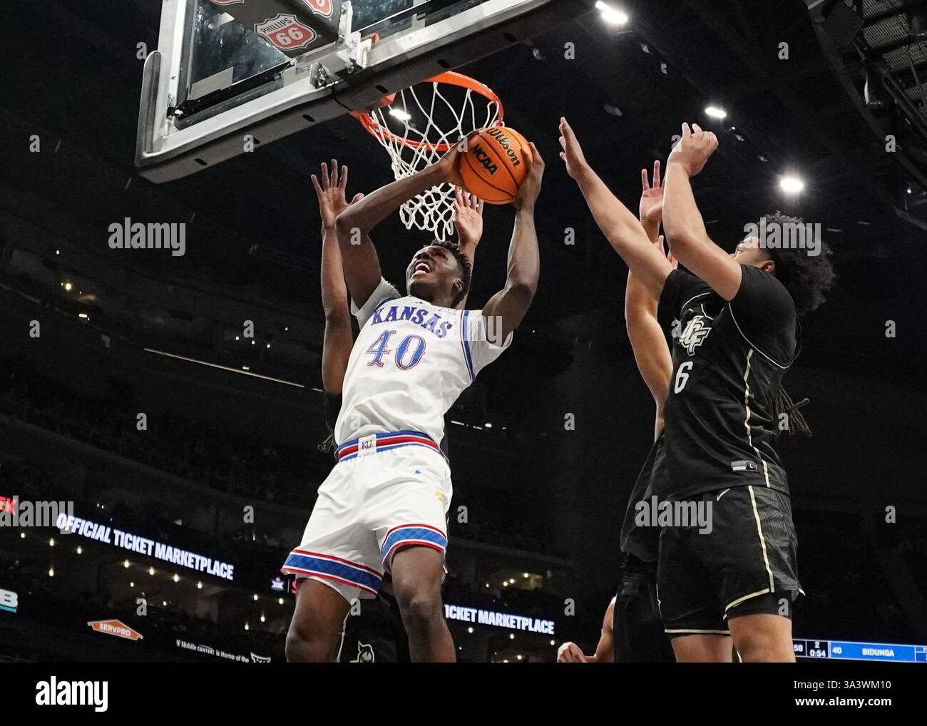MAR 12 2025: Kansas Jayhawks forward Flory Bidunga (40) fights through ...