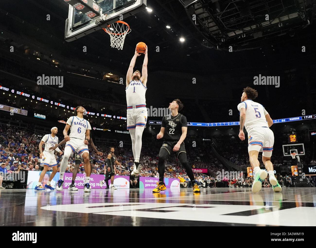 MAR 12 2025: Kansas Jayhawks center Hunter Dickinson (1) leaps for a ...