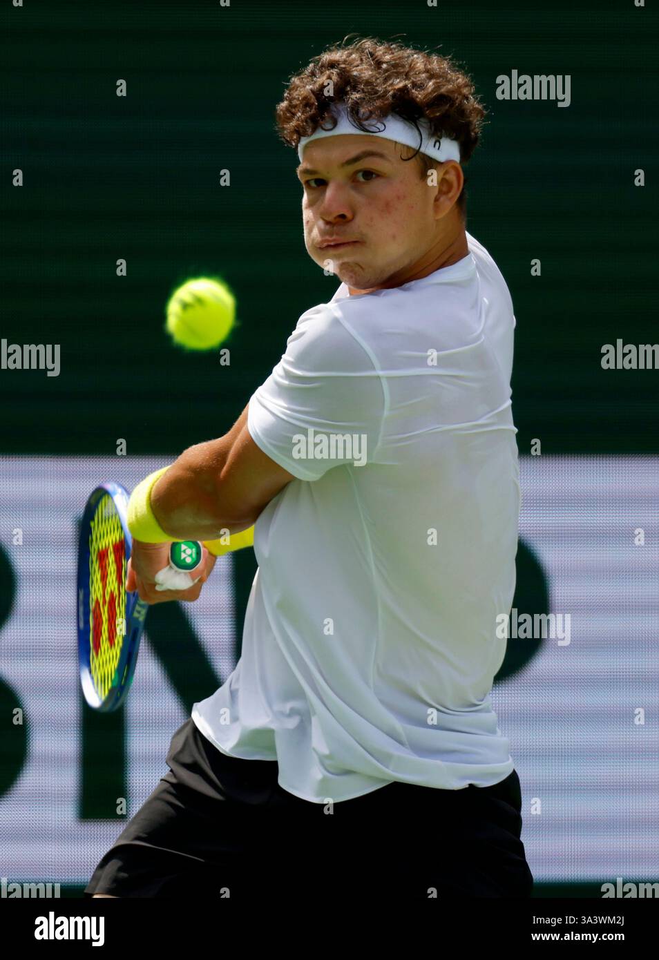 March 12, 2025 Ben Shelton returns a shot against Brandon Nakashima ...