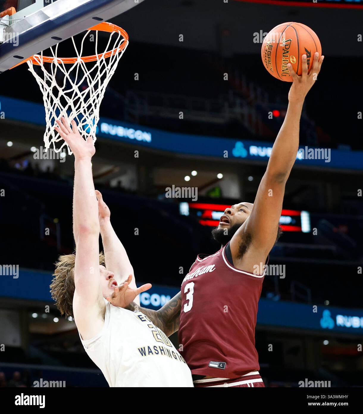 March 13, 2025: Fordham Rams G/F #3 Jahmere Tripp goes to the basket ...