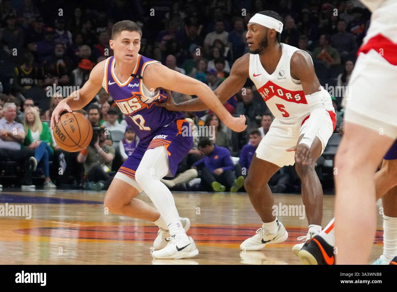 Phoenix Suns guard Collin Gillespie (12) brings the ball upcourt ...