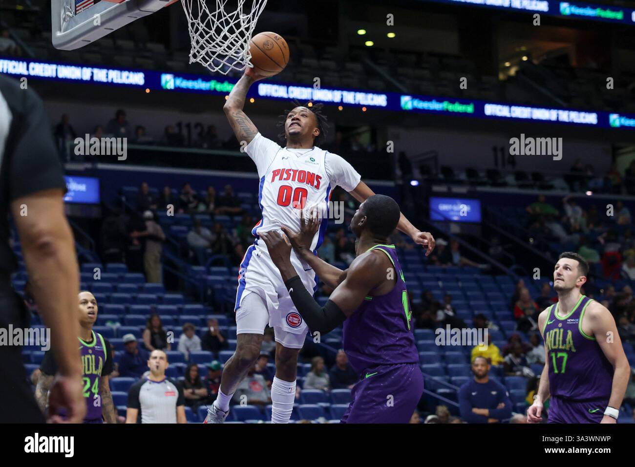 Detroit Pistons forward Ronald Holland II (00) throws down a dunk over ...