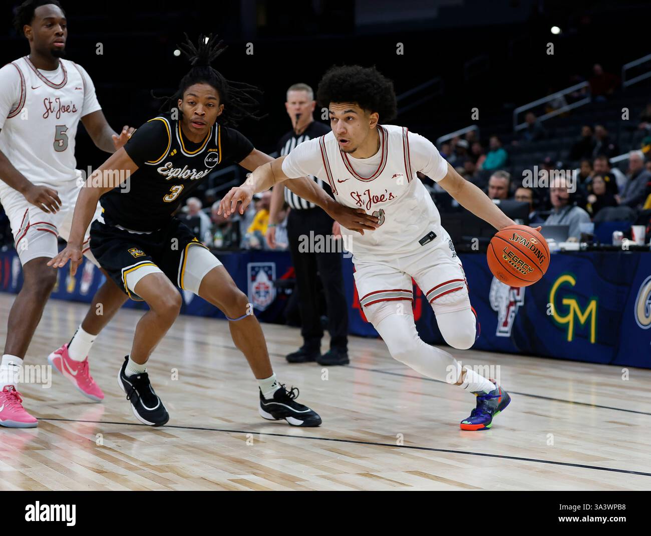 March 13, 2025: Saint Joseph's Hawks Guard (0) Derek Simpson works against La Salle Explorers ...