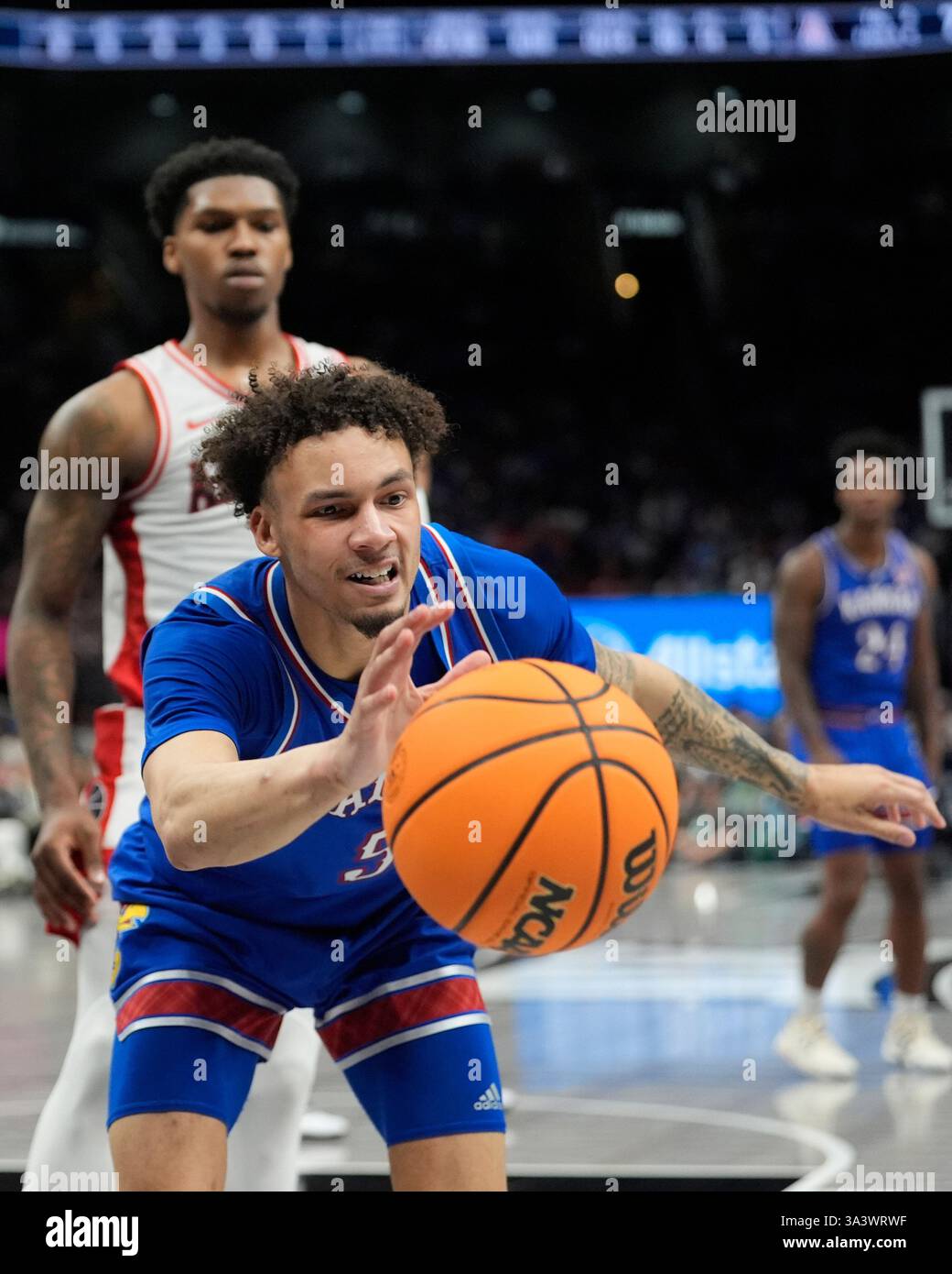 MAR 13 2025: Kansas Jayhawks guard Zeke Mayo (5) saves a pass. From ...