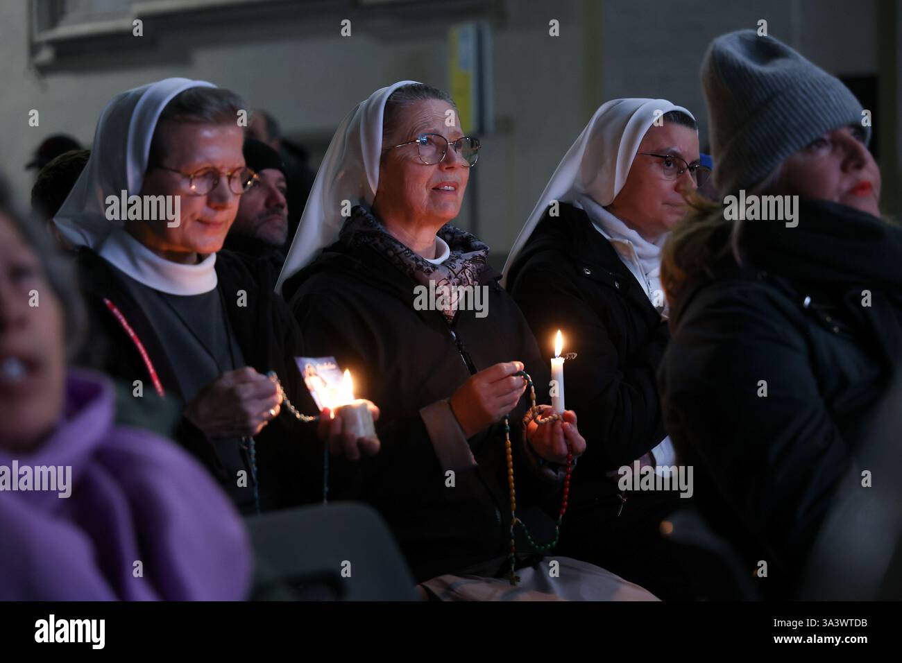 Vatican, Italy. 17th Mar, 2025. Nuns recite the rosary during the ...