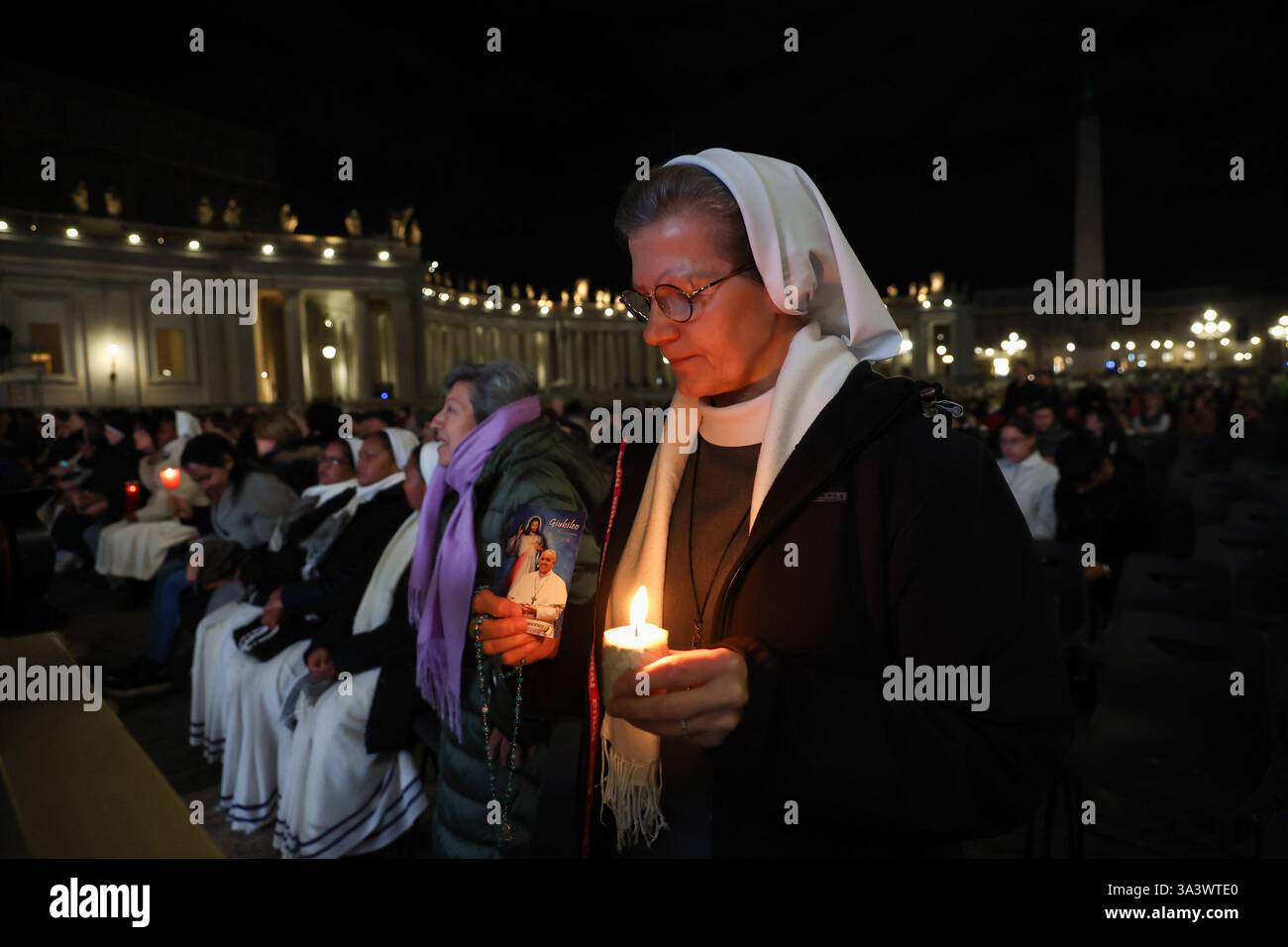 Vatican, Italy. 17th Mar, 2025. A nun recites the rosary during the ...