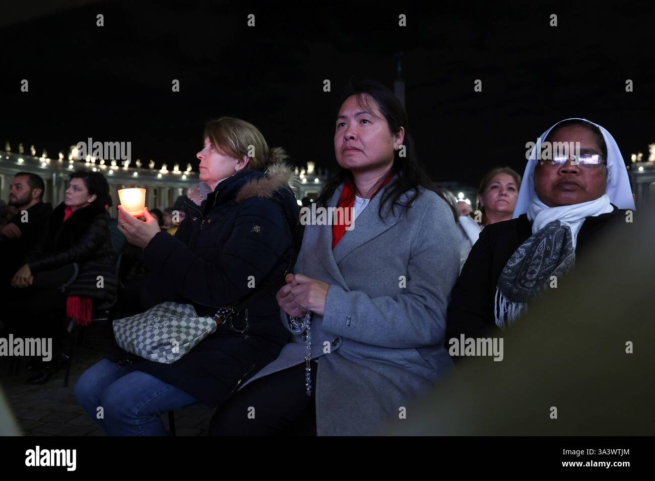 Vatican, Italy. 17th Mar, 2025. Faithful pray and recite the rosary ...