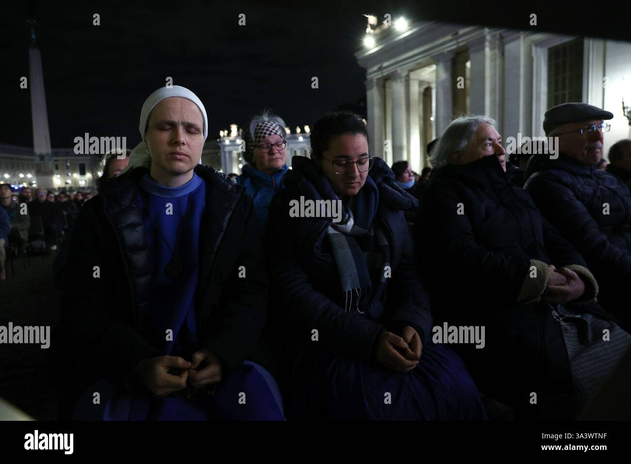 Faithful pray and recite the rosary during the prayer of the Holy ...