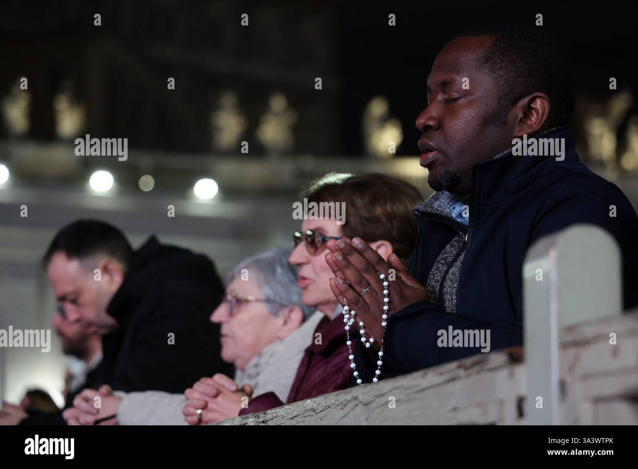 Vatican, Italy. 17th Mar, 2025. Faithful pray and recite the rosary ...