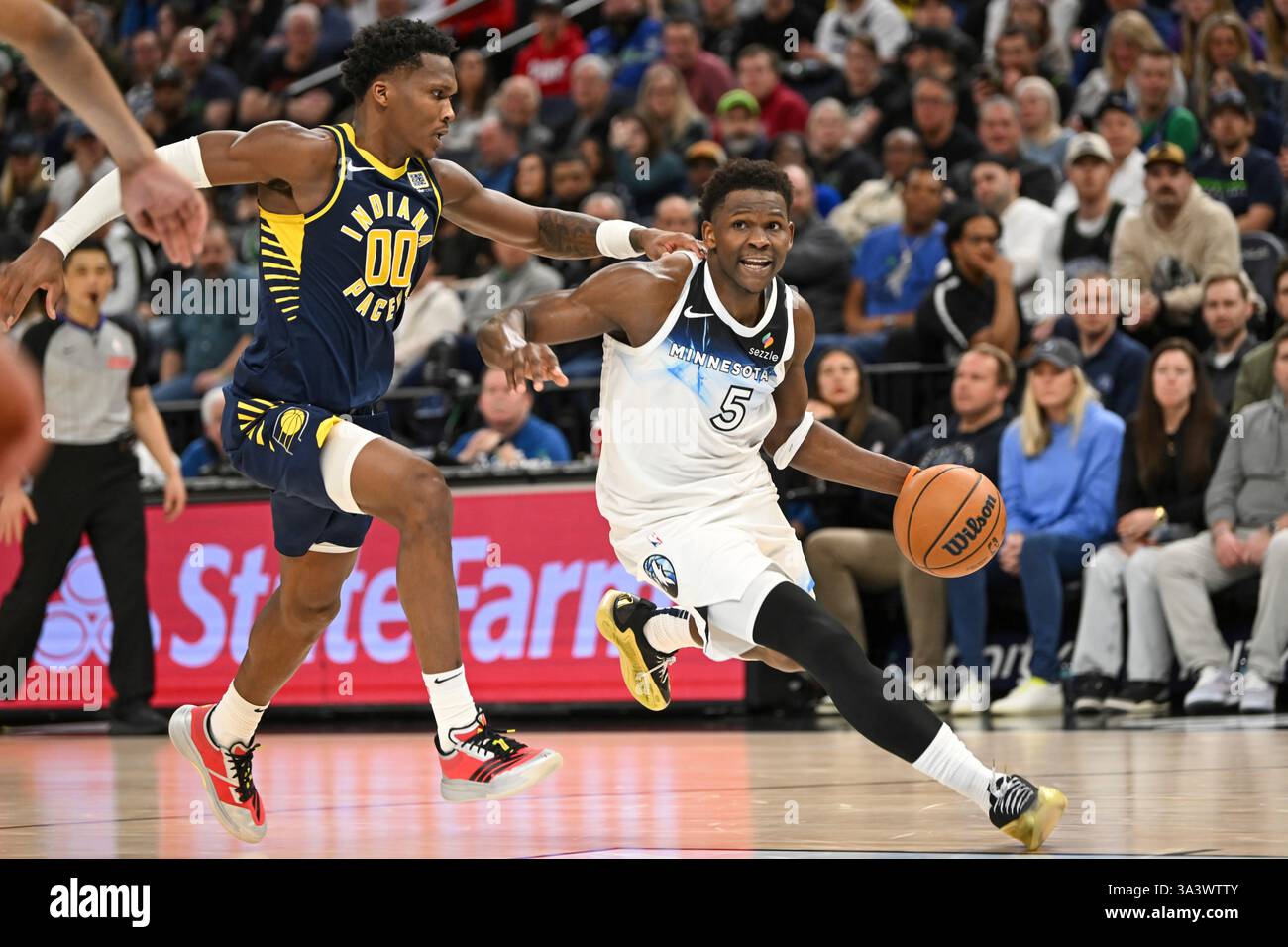 Minnesota Timberwolves guard Anthony Edwards (5) drives past Indiana ...