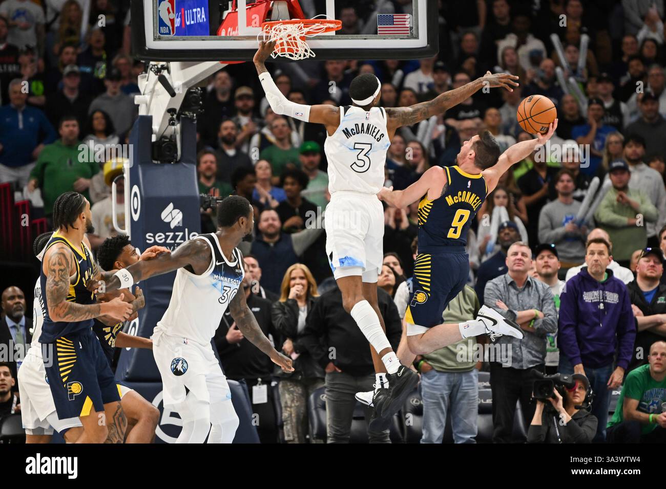 Indiana Pacers guard T.J. McConnell (9) goes up to score against Minnesota Timberwolves forward ...