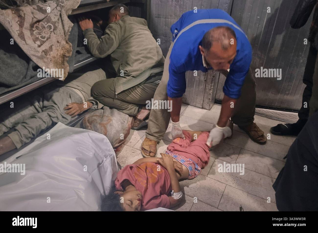 EDS NOTE GRAPHIC CONTENT.- The body of a child is placed on the floor ...