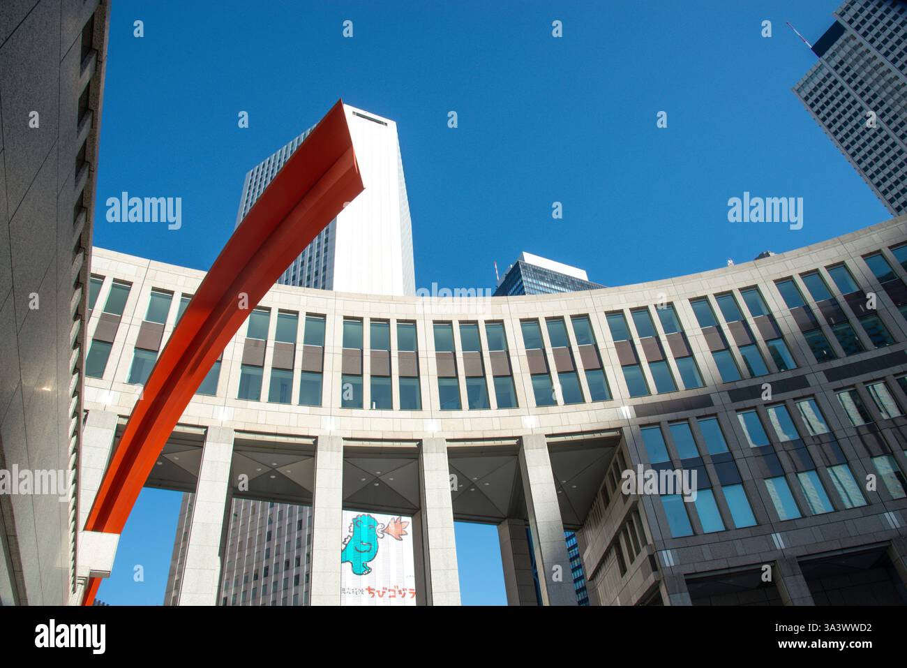 Red steel sculpture and colonnade of the Tokyo Metropolitan Government ...