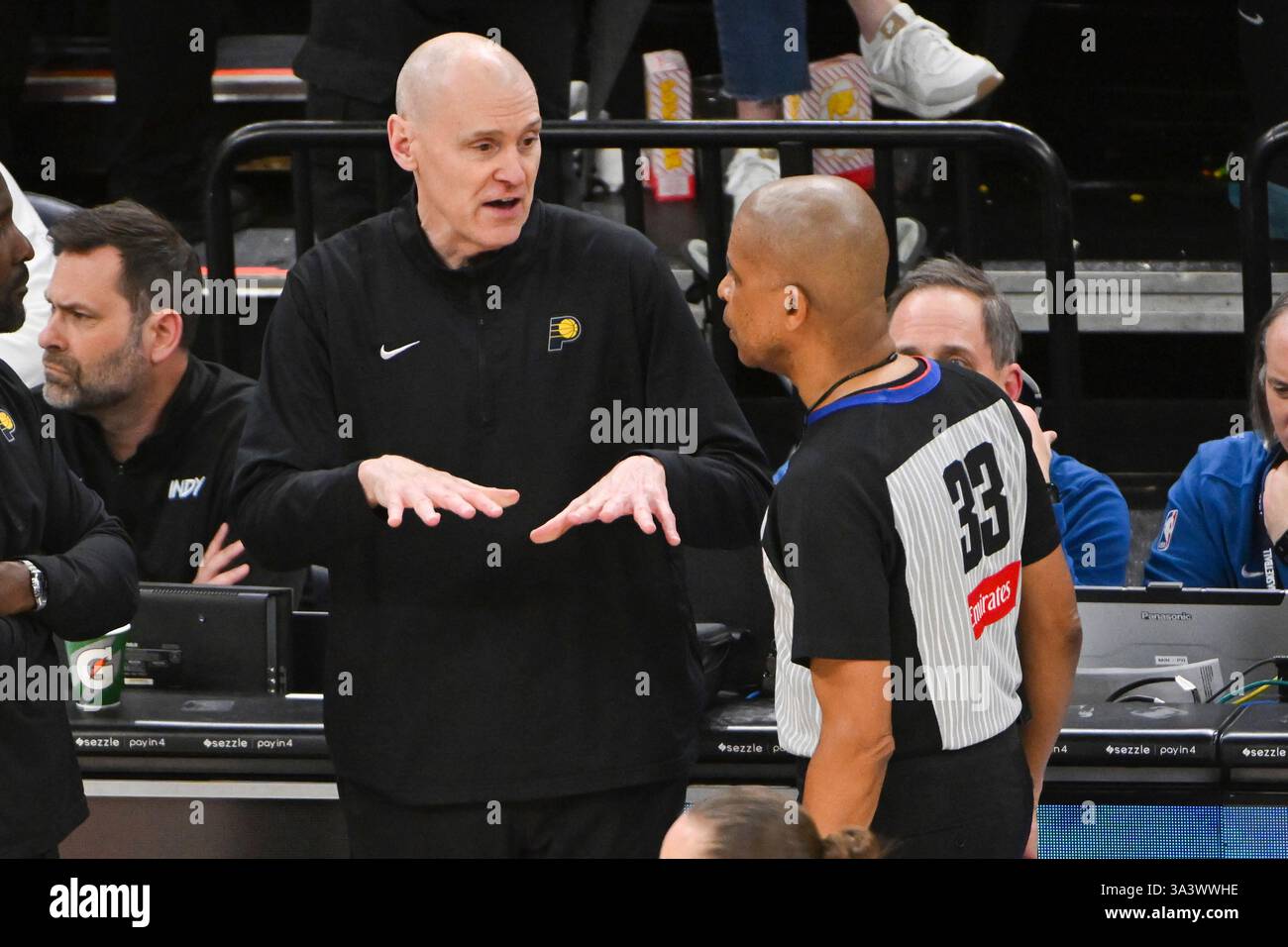 Indiana Pacers head coach Rick Carlisle, left, talks with referee Sean ...