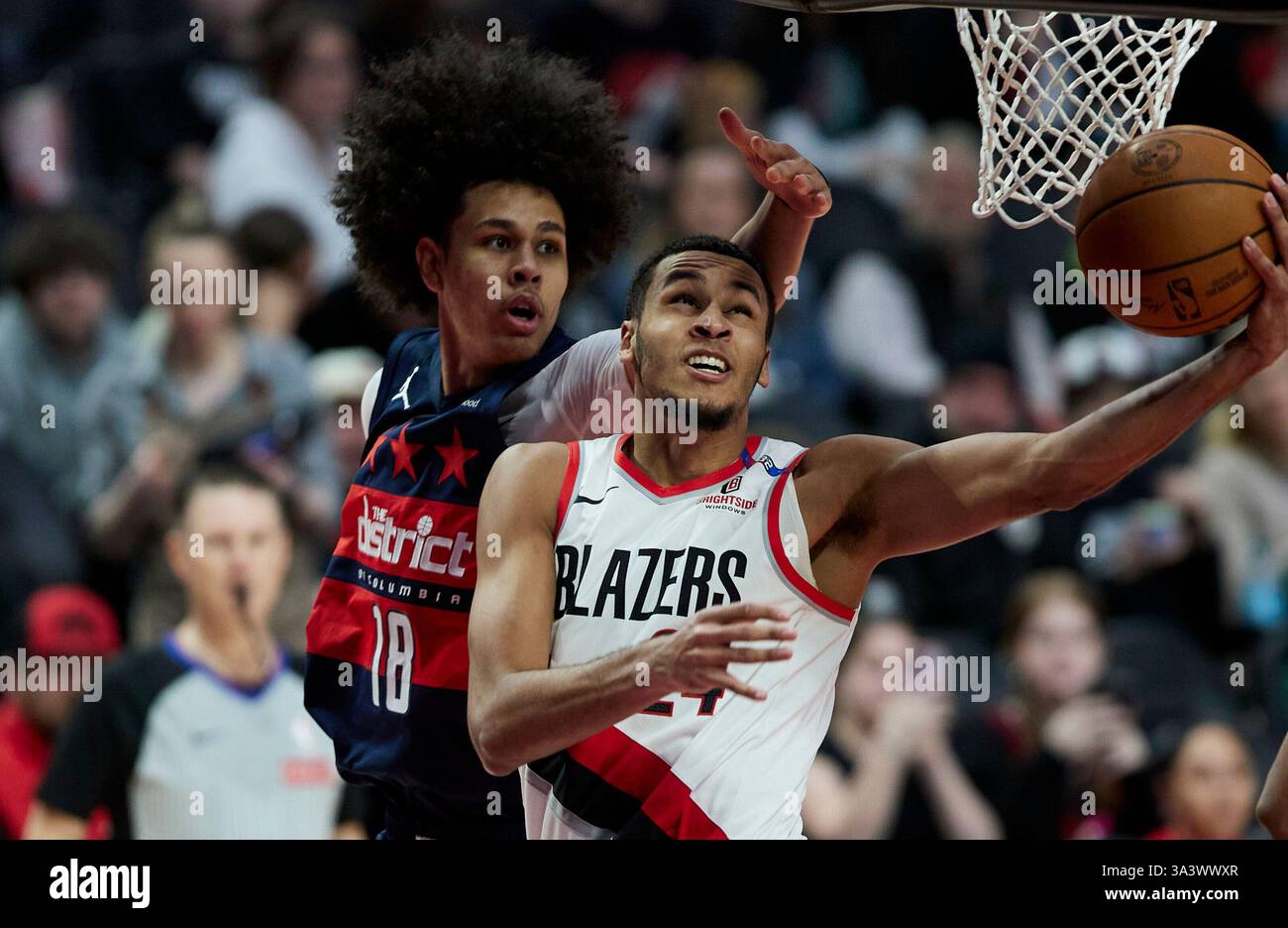 Portland Trail Blazers forward Kris Murray, right, shoots in front of ...