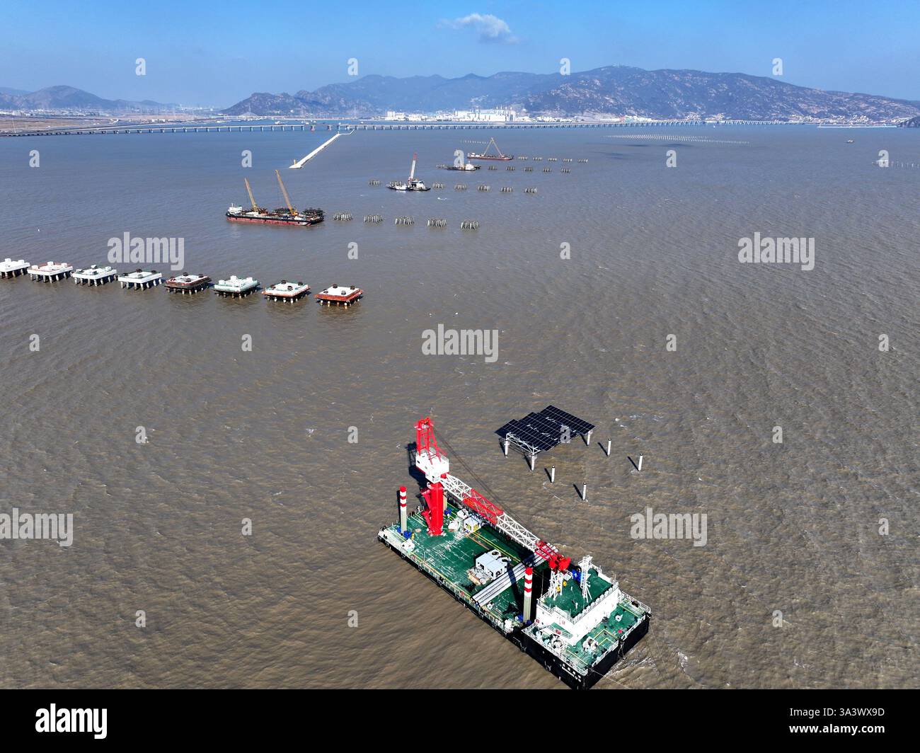 LIANYUNGANG, CHINA - MARCH 18, 2025 - Builders carry out offshore ...