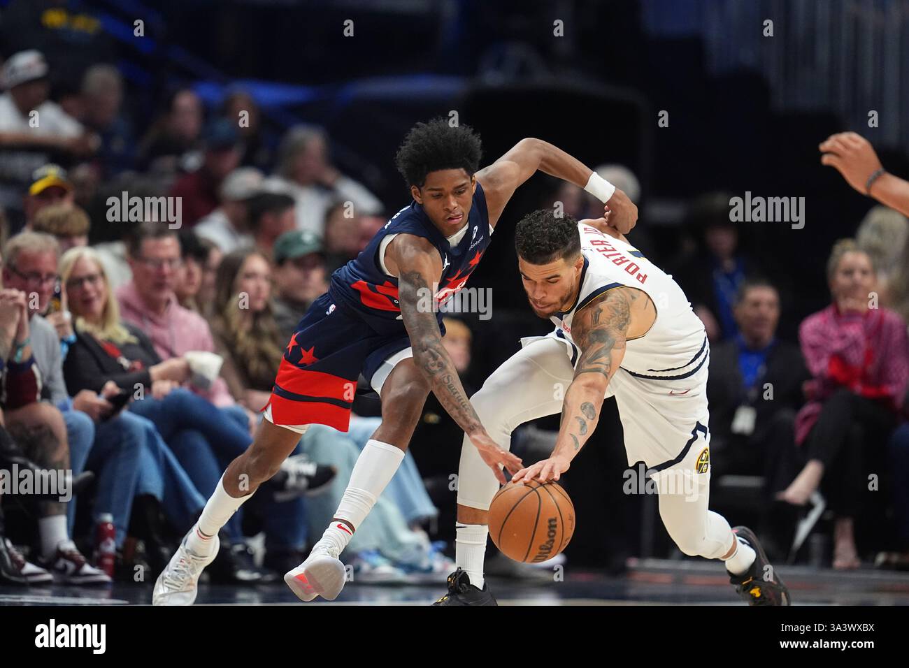 Washington Wizards guard AJ Johnson pursues a loose ball with Denver ...