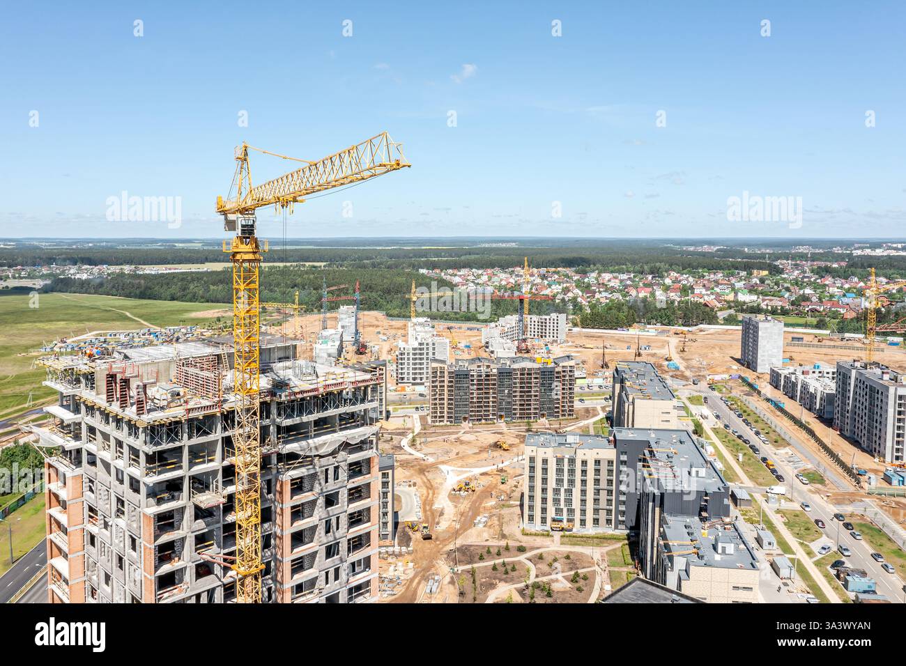 big construction site with cranes. new urban residential area under ...