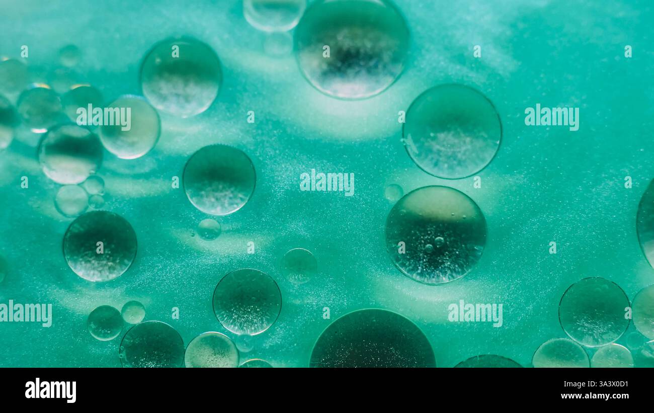 Chemical blob. Drop background. Defocused green color ink in water ...