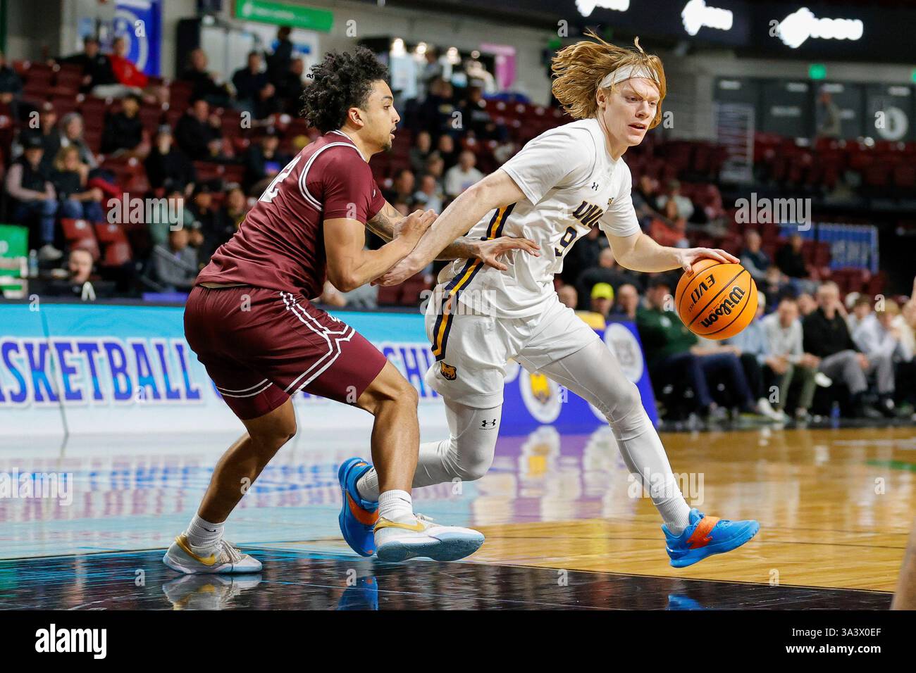 Northern Colorado guard Jaron Rillie (9) works the ball around the ...