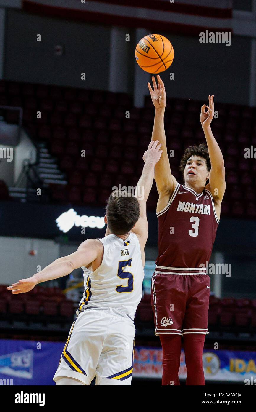Montana guard Malik Moore (3) with a three point shot over Northern ...