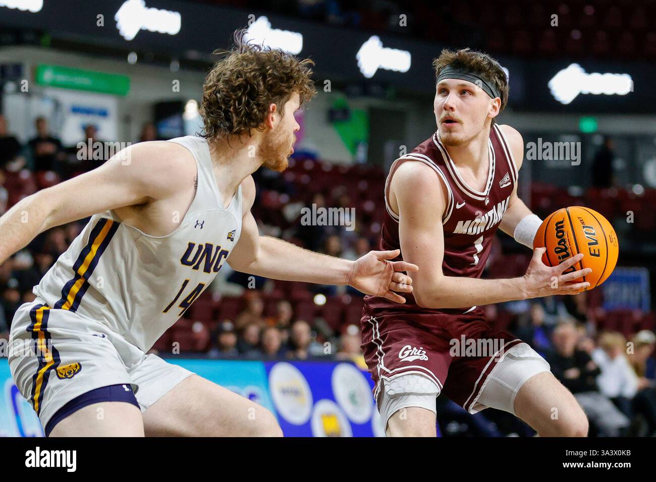 Montana guard Kai Johnson (1) stops with the ball against the defense ...