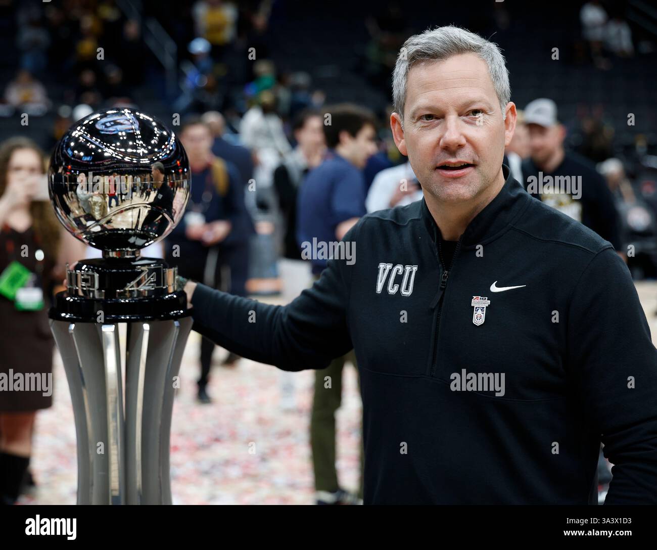 March 16, 2025: VCU Rams Head Coach Ryan Odom poses with the trophy ...
