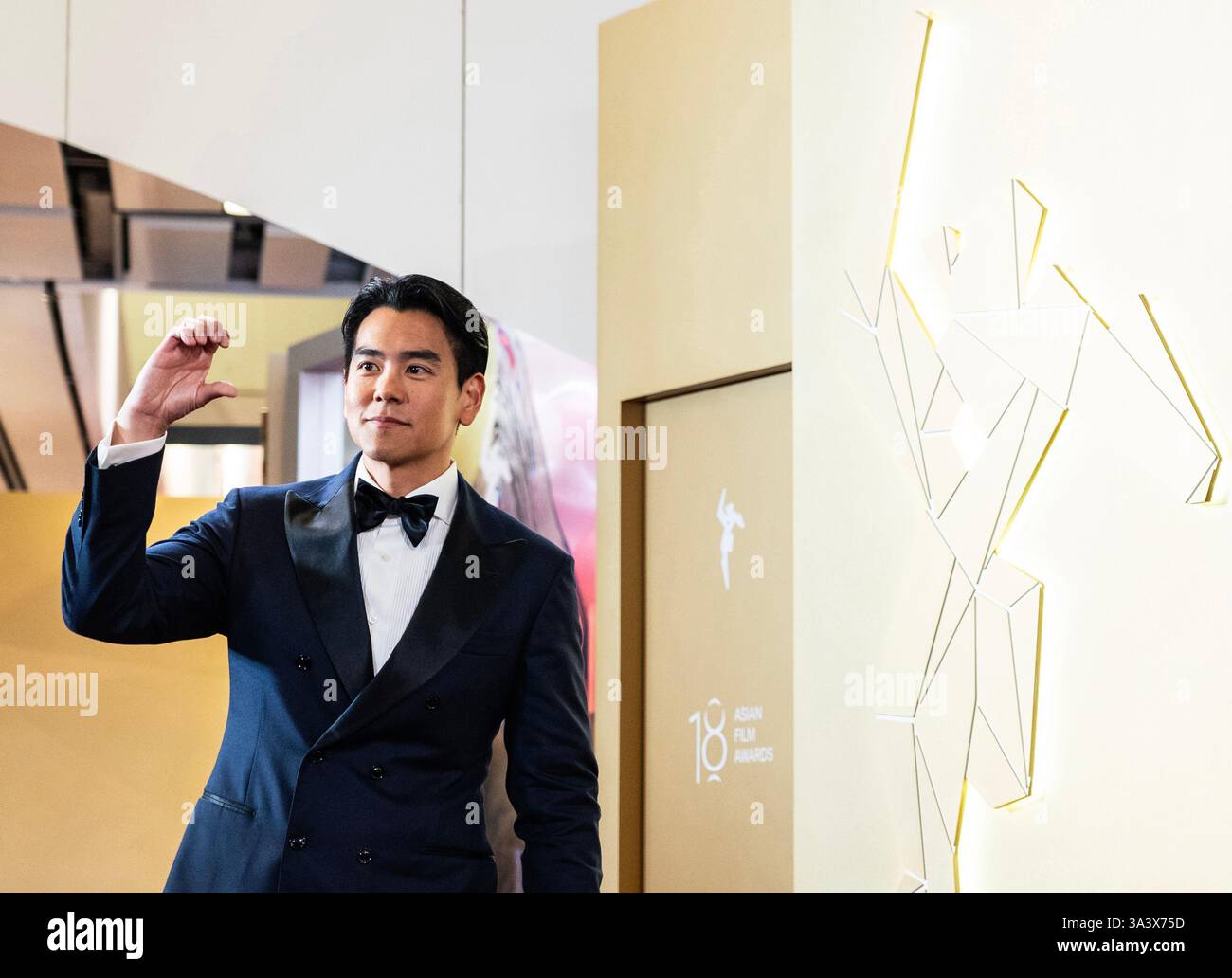 Famous actor Eddie Peng poses for photos on the red carpet. Hong Kong ...