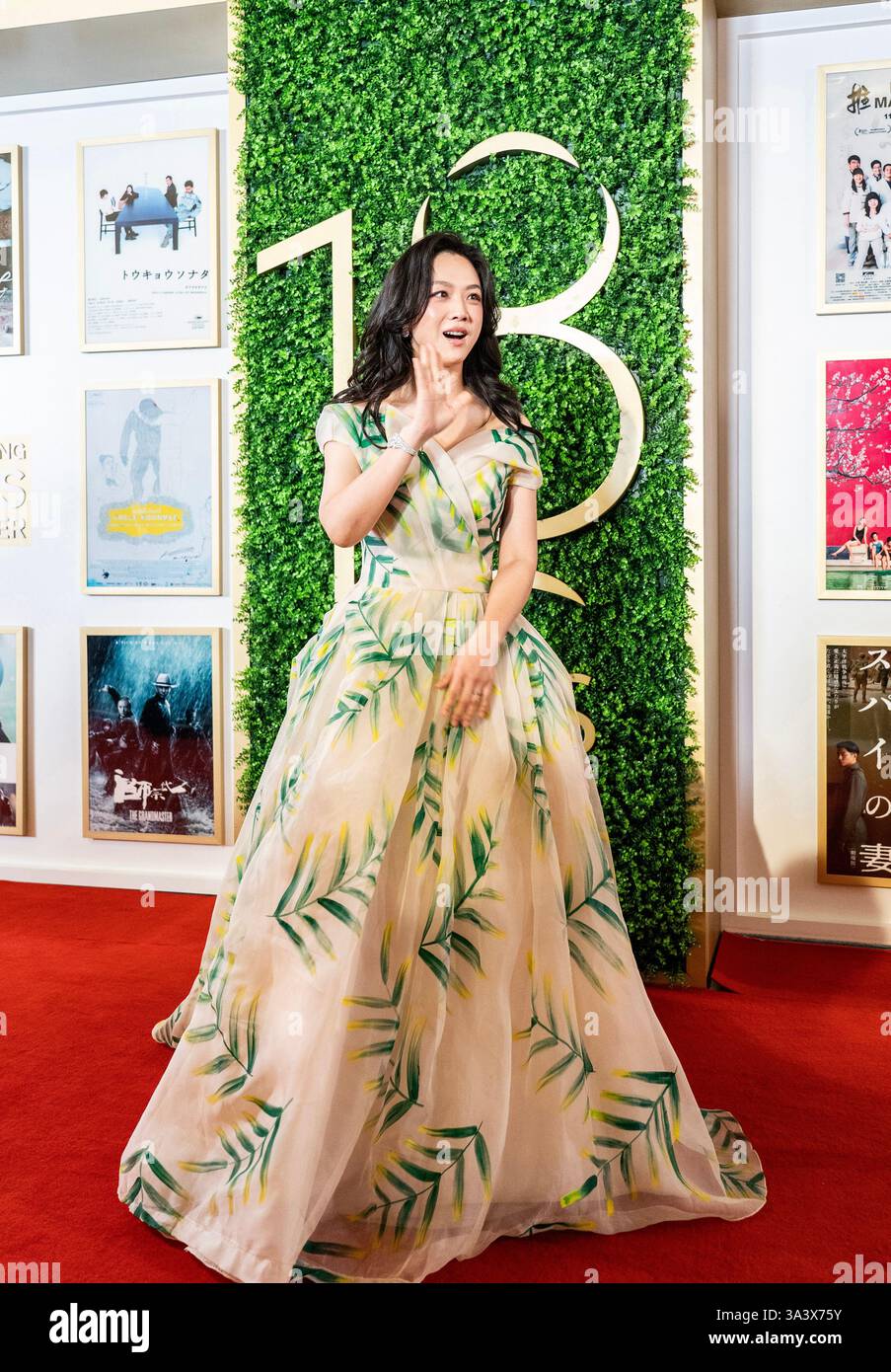 Chinese actress Tang Wei poses for photos on the red carpet. Hong Kong ...