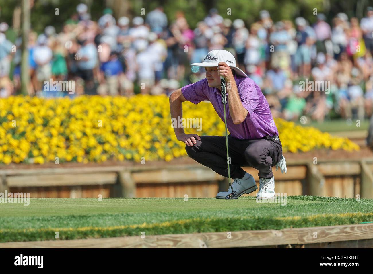 March 14, 2025: Joe Highsmith sizes up his putt on the 17th hole during ...