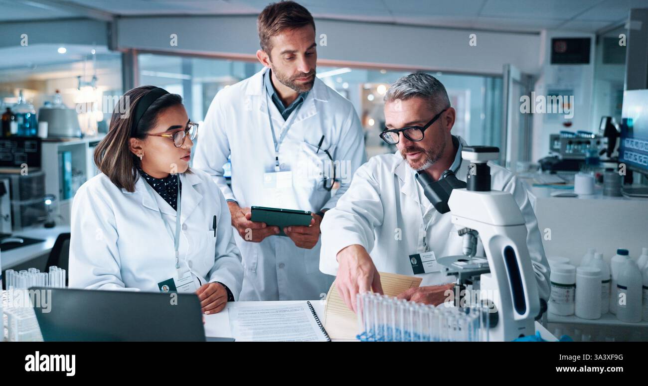 Collaboration, science and teaching with people in laboratory together for breakthrough or ...