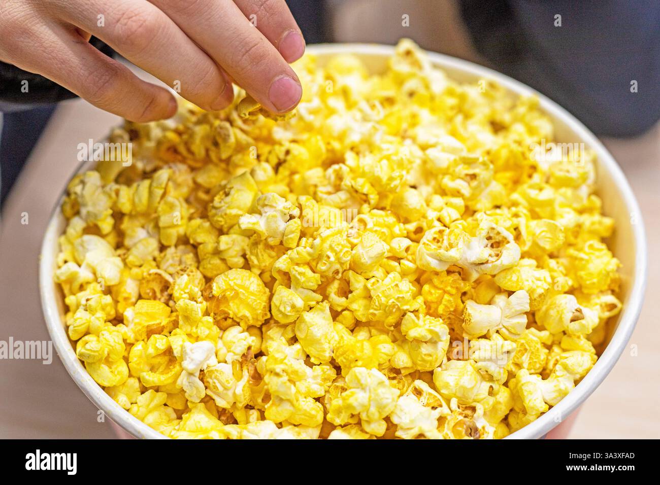 eating popcorn in the cinema before watching a movie. family weekend ...