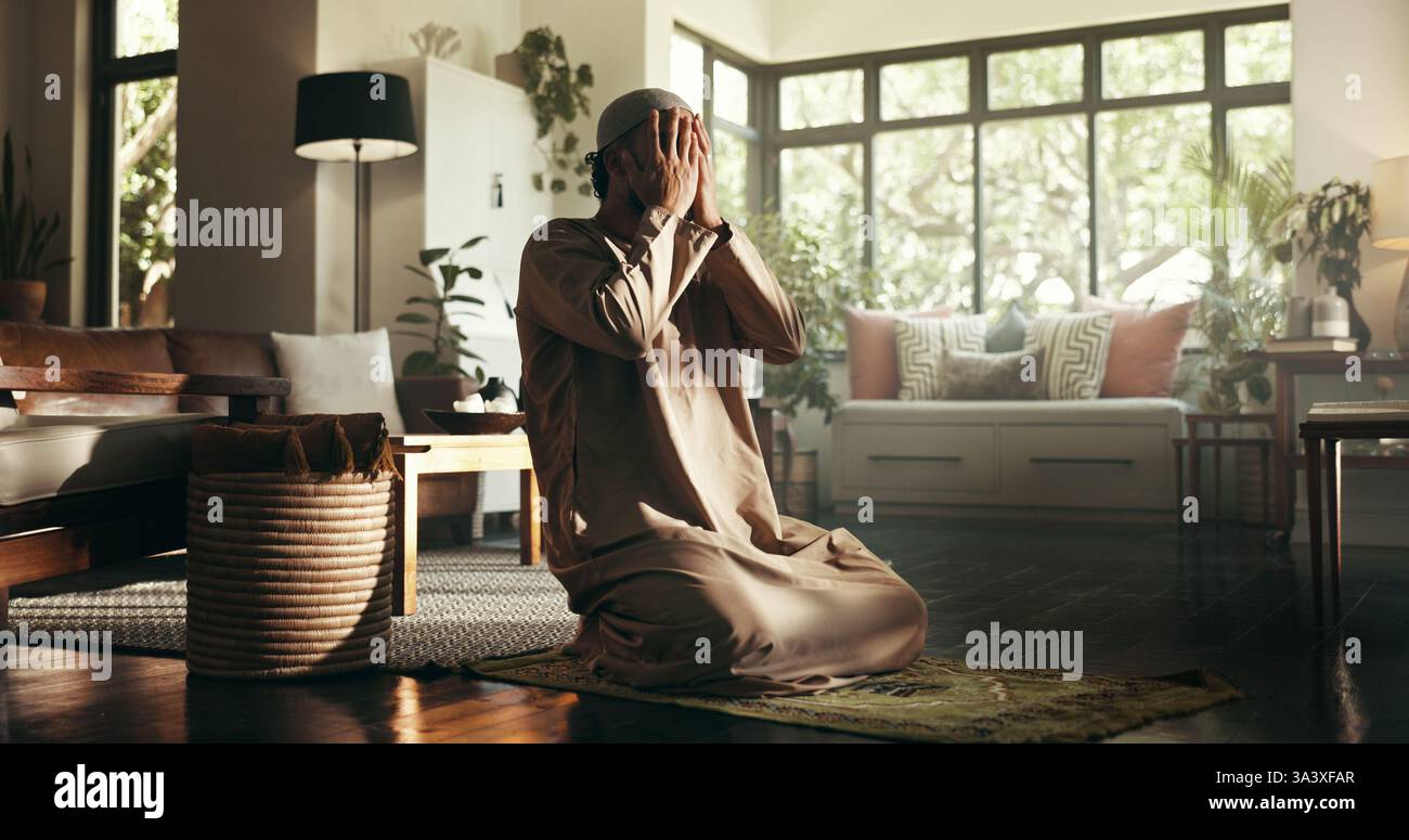 Muslim man, prayer and hands on face in home with mat for ramadan ...