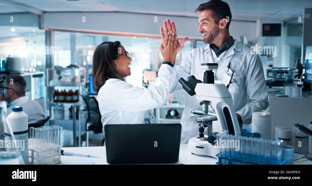 High five, science and teamwork with people in laboratory together for breakthrough or ...