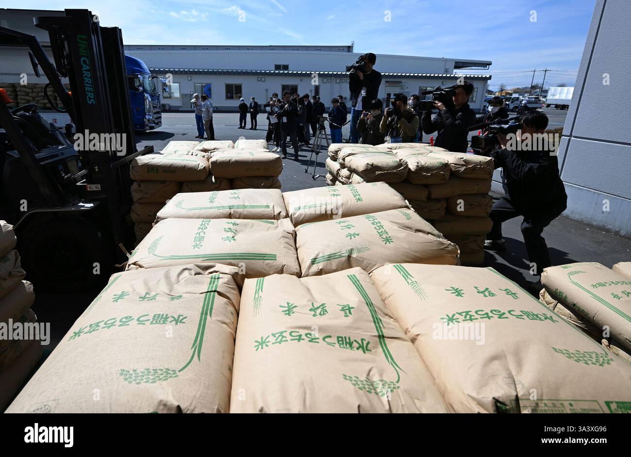 The government-stockpiled rice bags arrive at a rice mill in Saitama ...