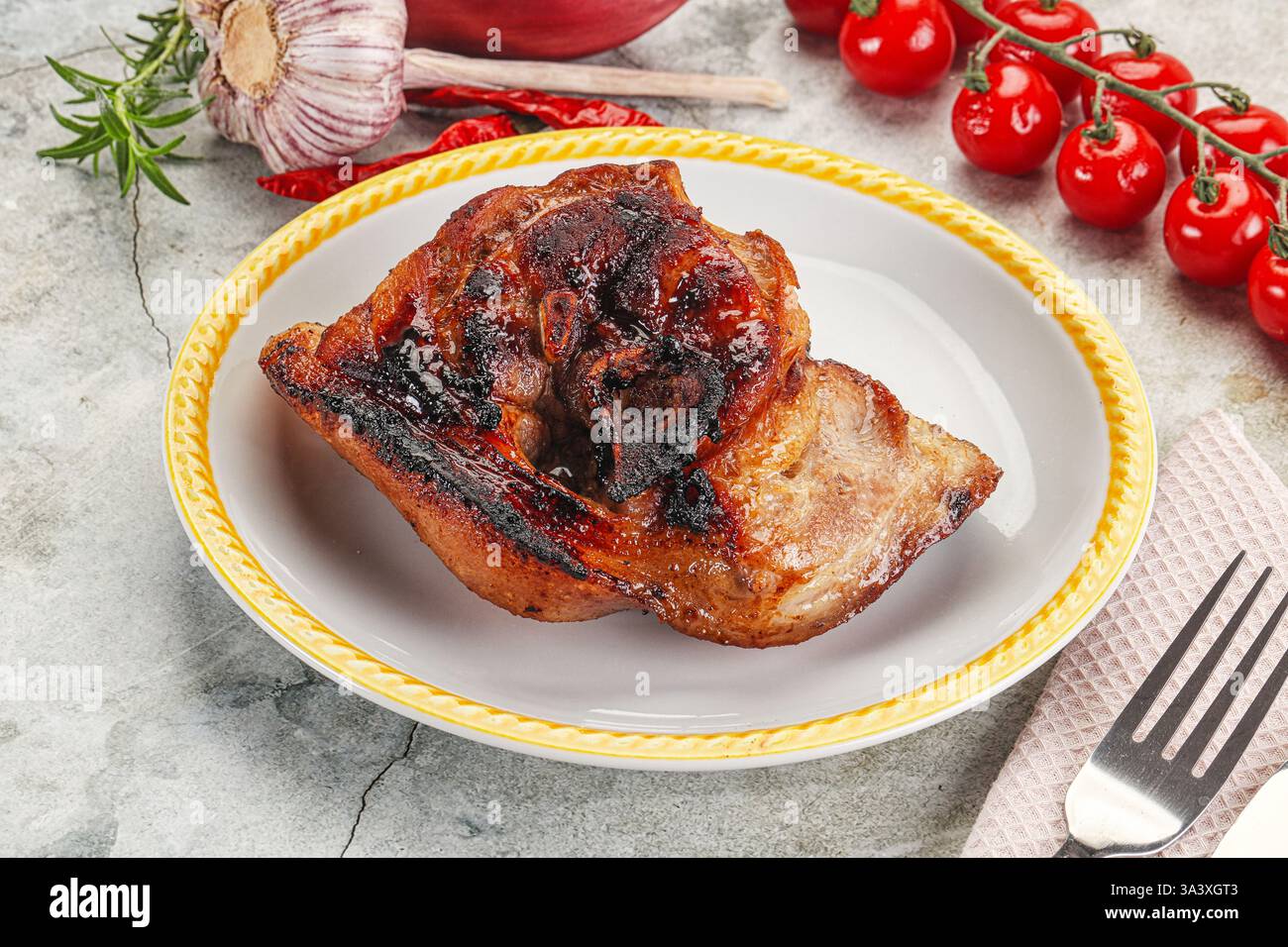 Roasted pork knuckle steak with bone Stock Photo - Alamy