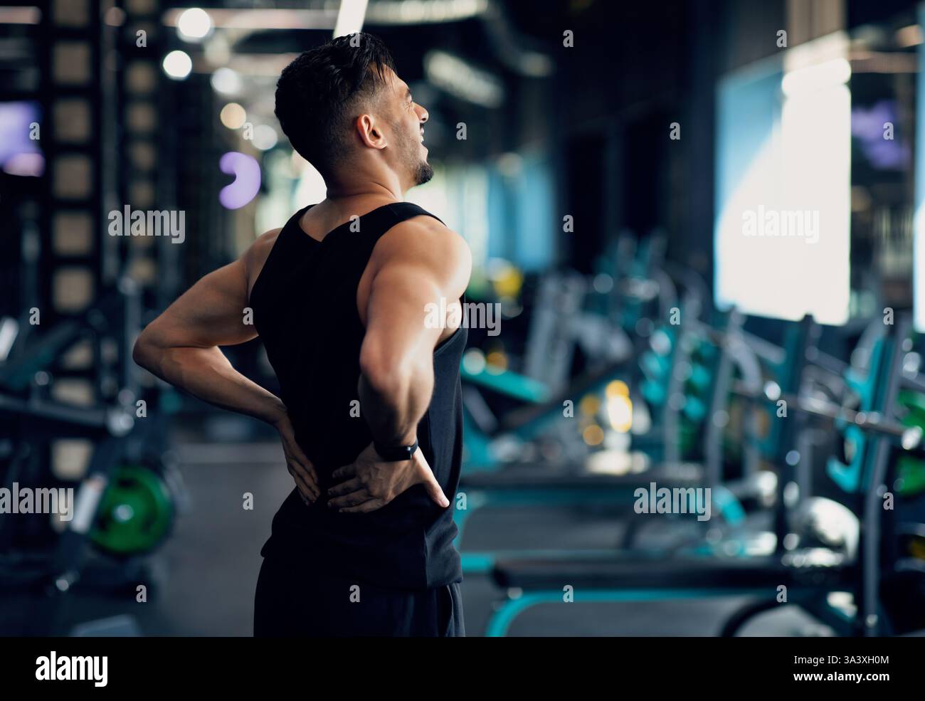 Portrait Of Young Arab Bodybuilder Suffering Lower Back Pain At Gym ...