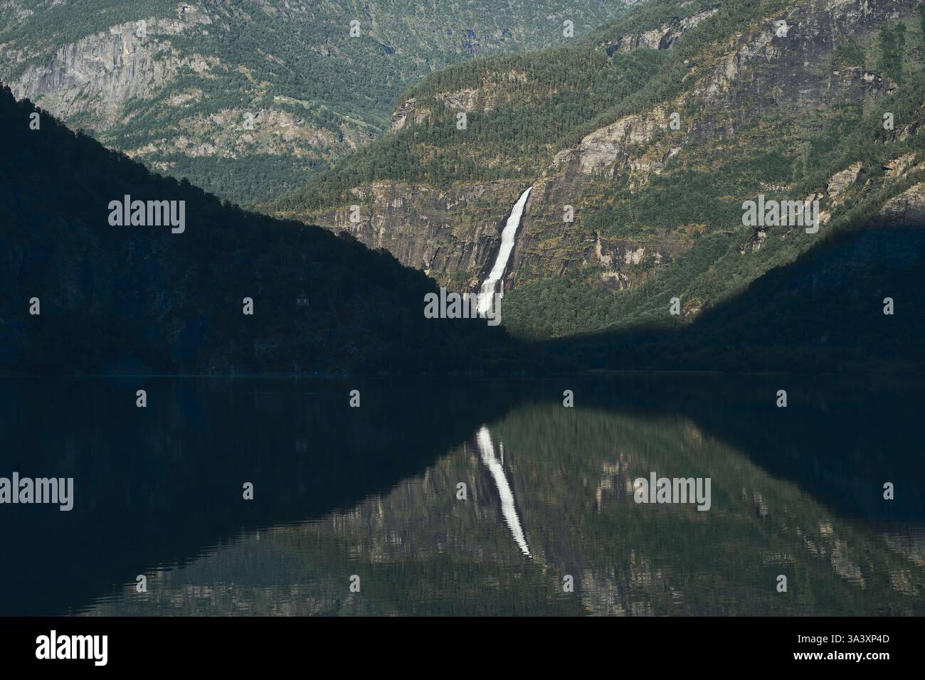 The Aasafossen Waterfall reflected in the Eidsvatnet Lake, Skjolden ...