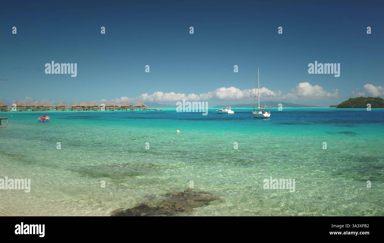 Crystal clear turquoise water gently lapping sand beach shore ...
