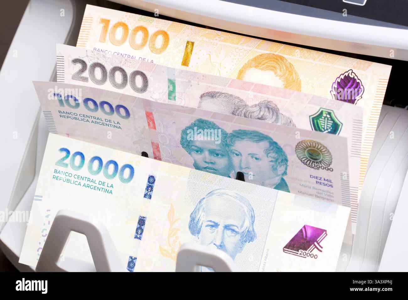 Argentine money - peso in the counting machine Stock Photo - Alamy